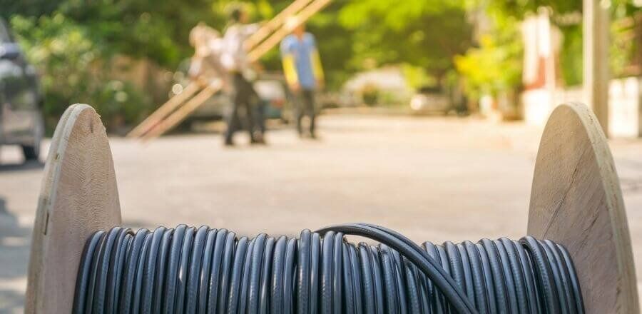 Fiber Optic Cable Installation, Overhead vs. Buried Laying